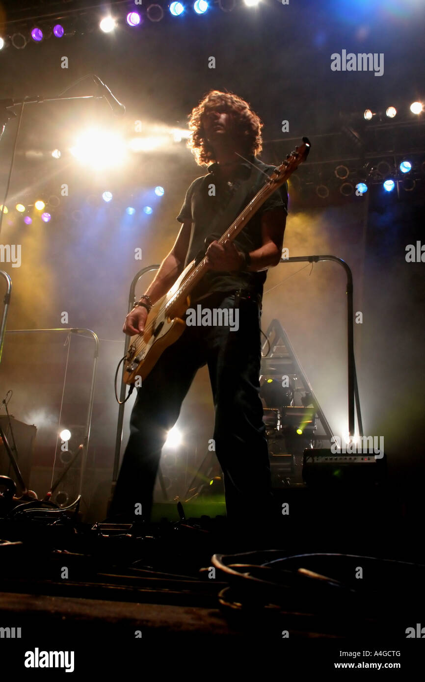 Music man in stage lights Stock Photo - Alamy