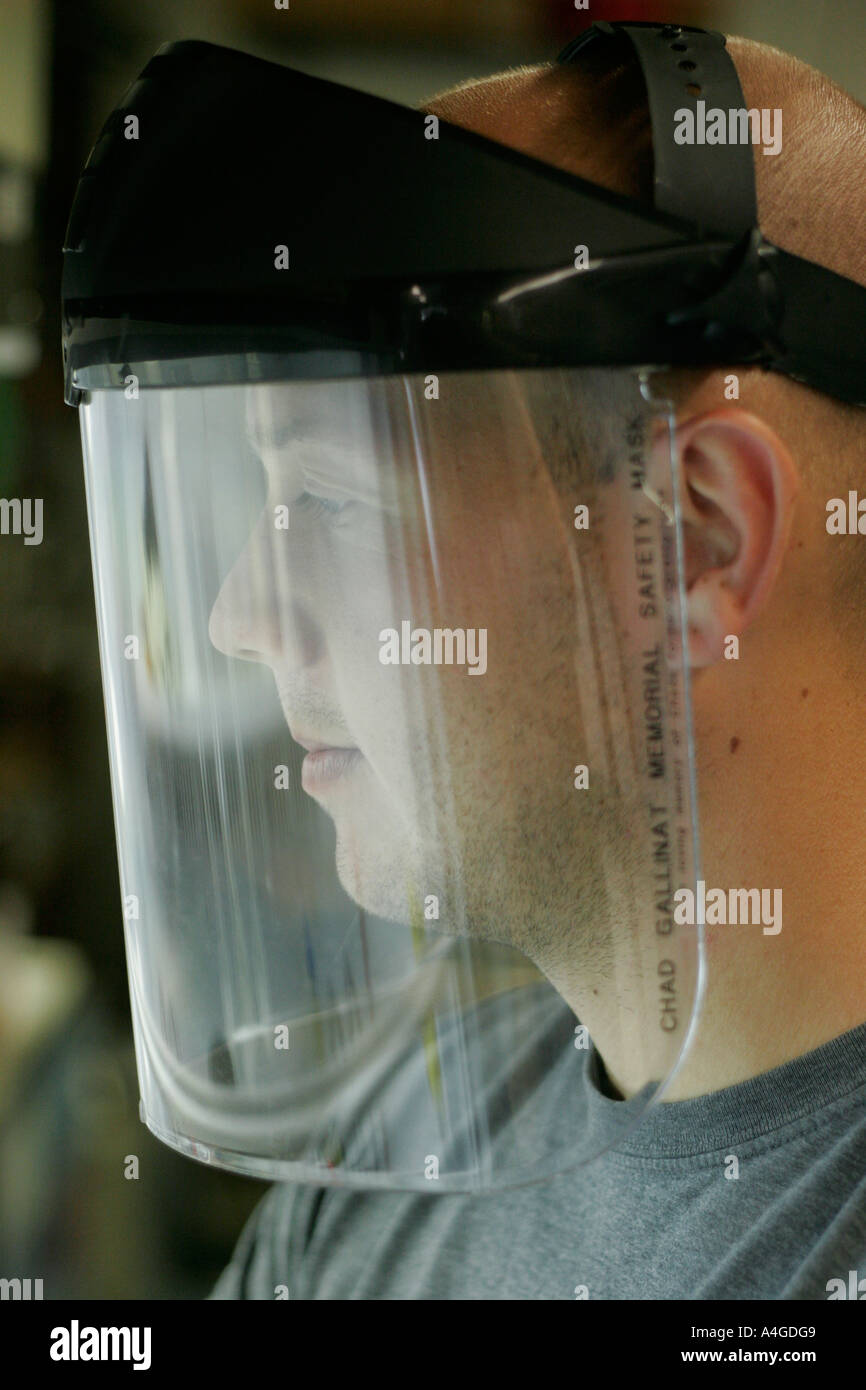 Graduate student wearing face shield in a laboratory at University of ...