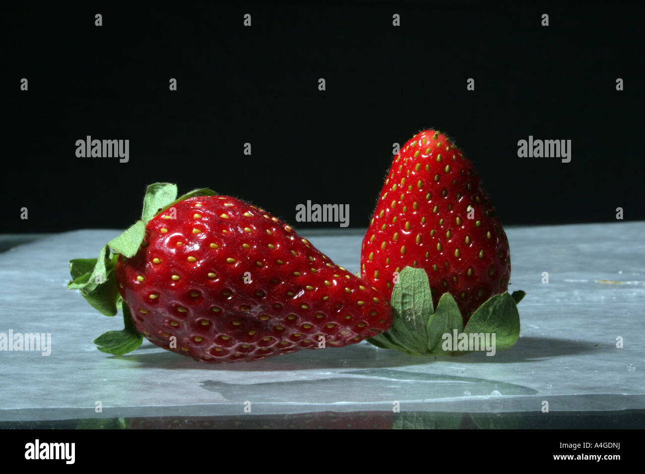 Two Strawberries together Stock Photo - Alamy