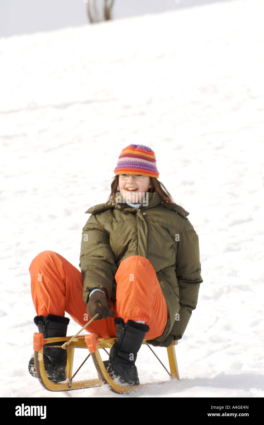 girl with sledge into the snow Stock Photo - Alamy