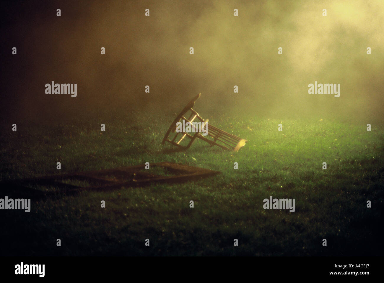 A rocking chair and door frame laying in the back yard of a fire scene ...