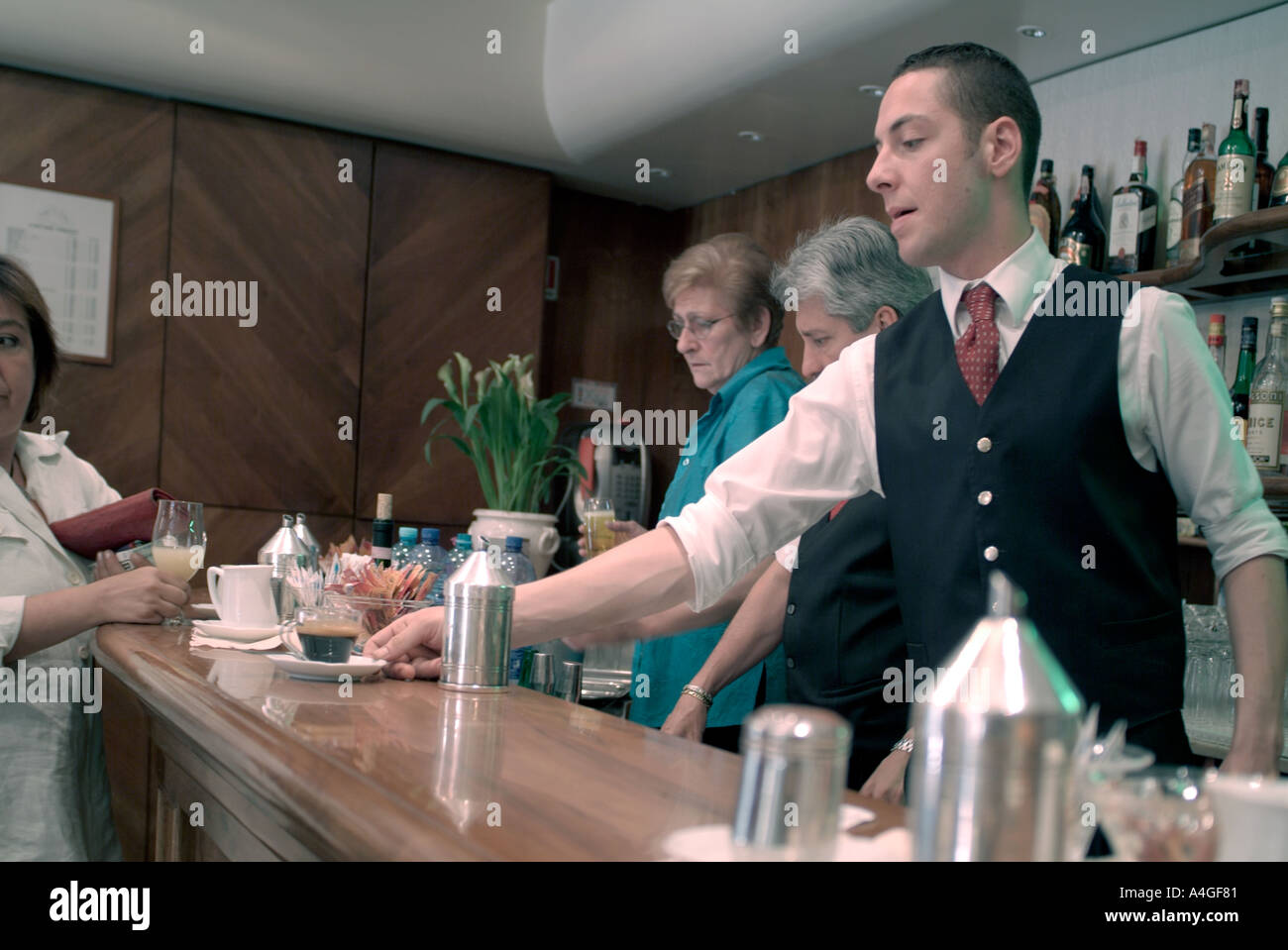 italian barman serving coffee Stock Photo - Alamy