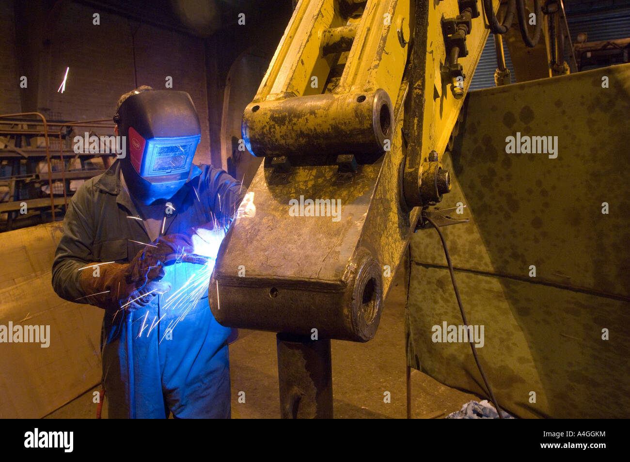 A welder repairs plant in his workshop Stock Photo - Alamy