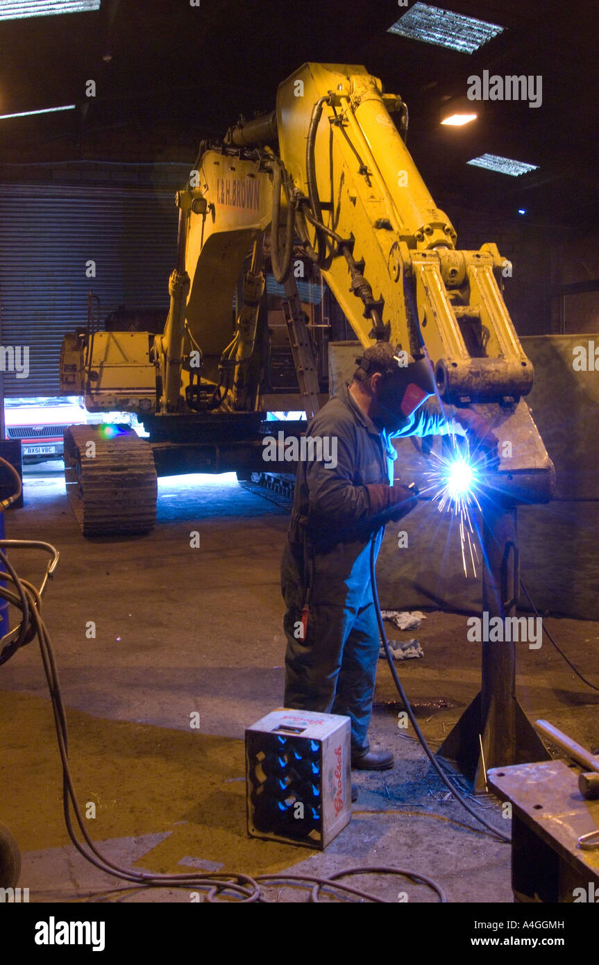 A welder repairs plant in his workshop Stock Photo - Alamy
