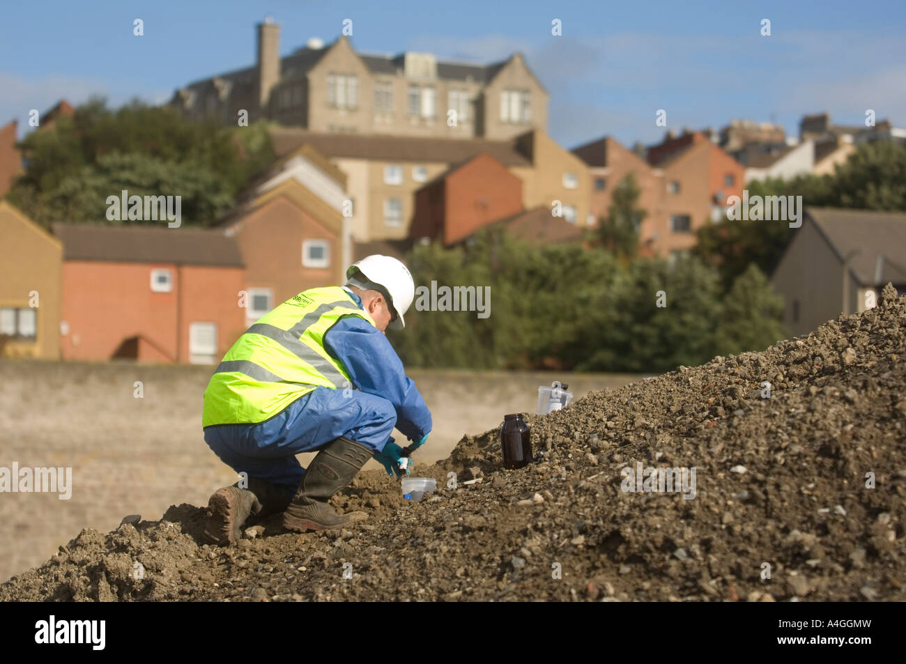 Geologist on brown field development site taking samples Stock Photo ...