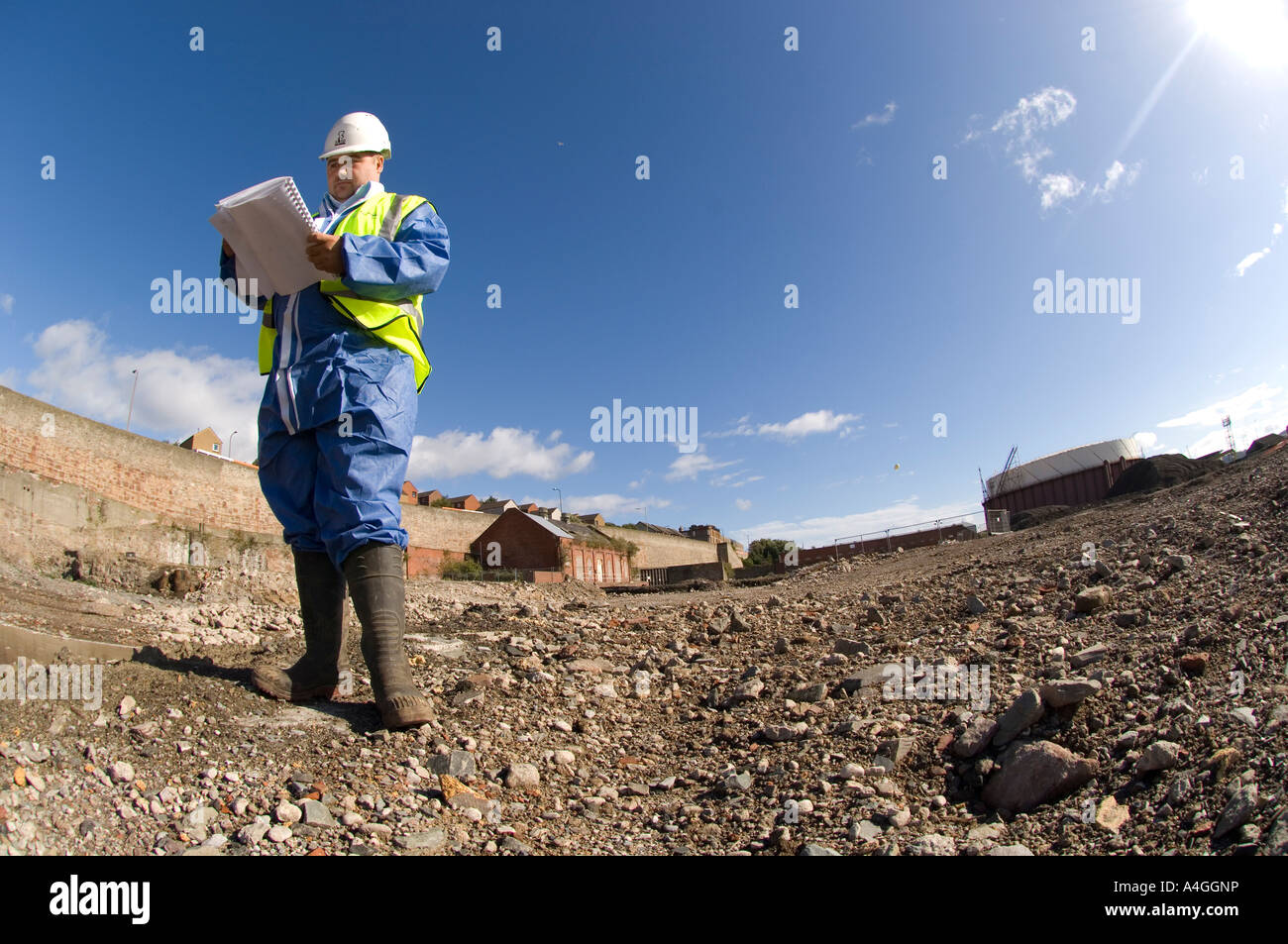 Geologist on brown field development site taking samples Stock Photo ...