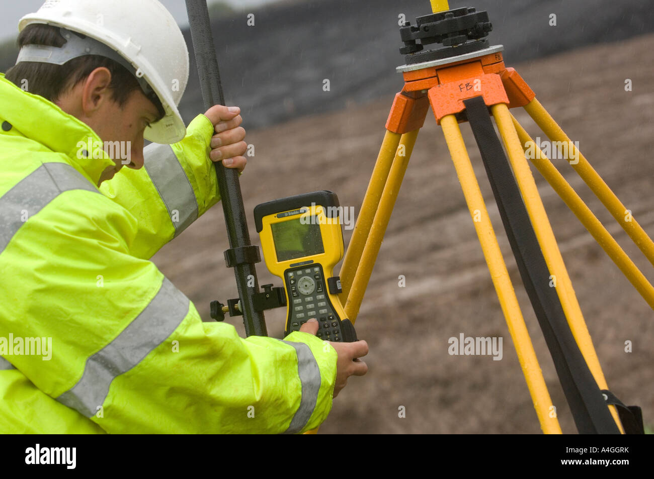 A surveyor collects information on a building site Stock Photo - Alamy