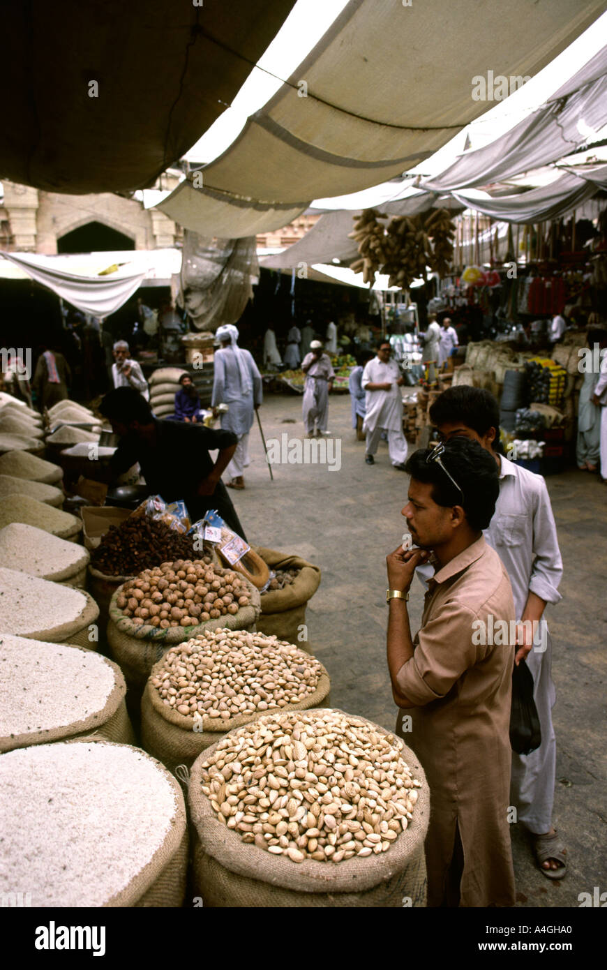 Pakistan Sind Karachi Saddar Empress Market customer at rice and nut ...