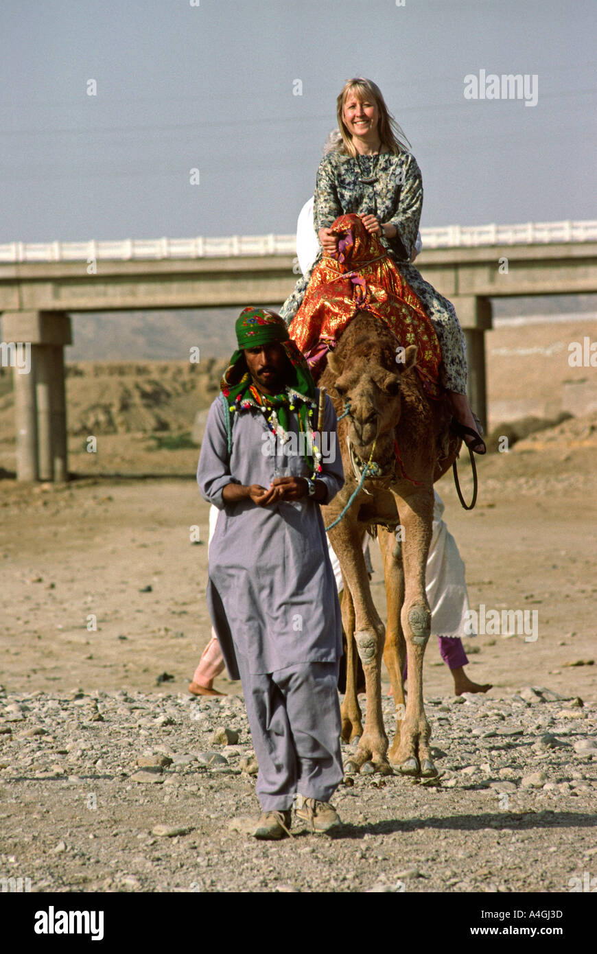 Pakistan Sind Karachi western tourists on Camel at Paradise Point beach ...