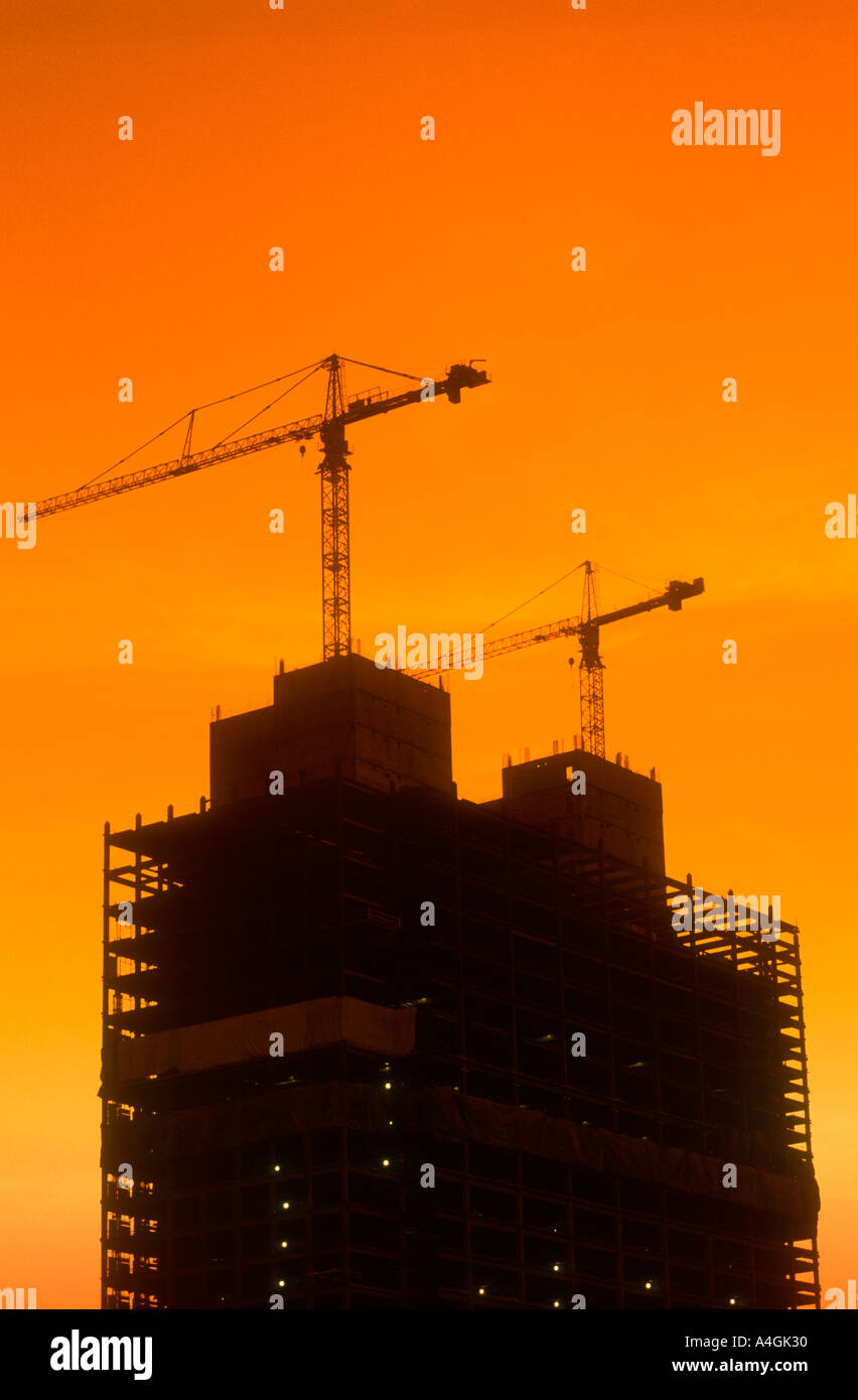 Crane on top high rise hi-res stock photography and images - Alamy