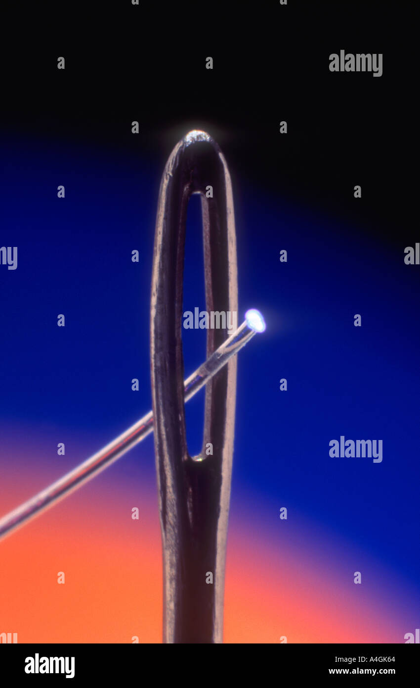 Fiber Optic Strand through Eye of Needle Stock Photo - Alamy