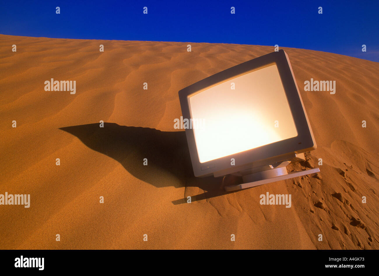 Computer Monitor in Desert Stock Photo - Alamy