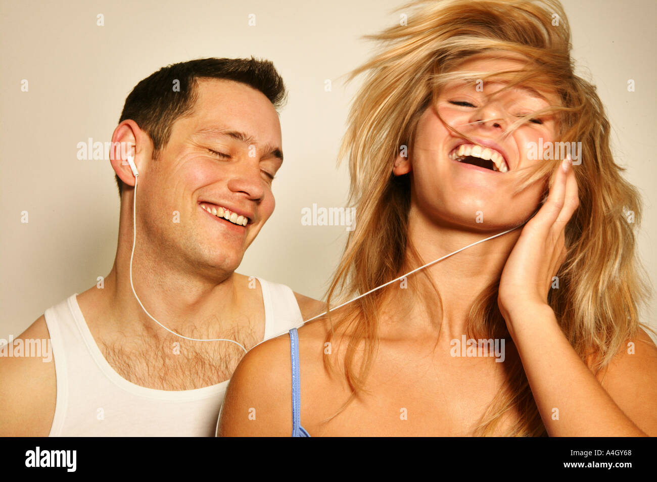 Couple listening to music Stock Photo - Alamy