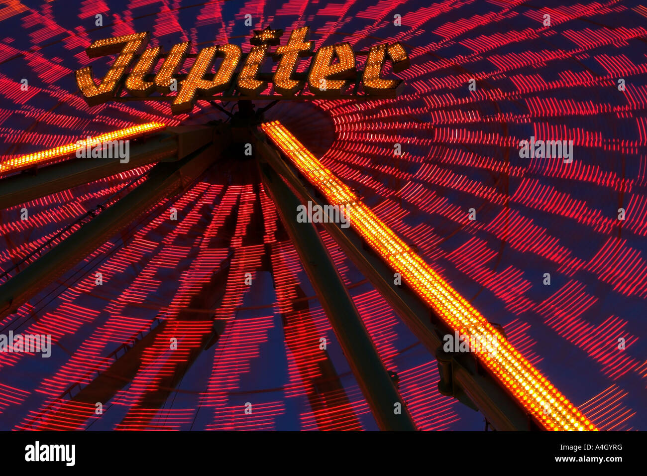 Detail of a Ferris Wheel in movement, with pattern of illumination and ...