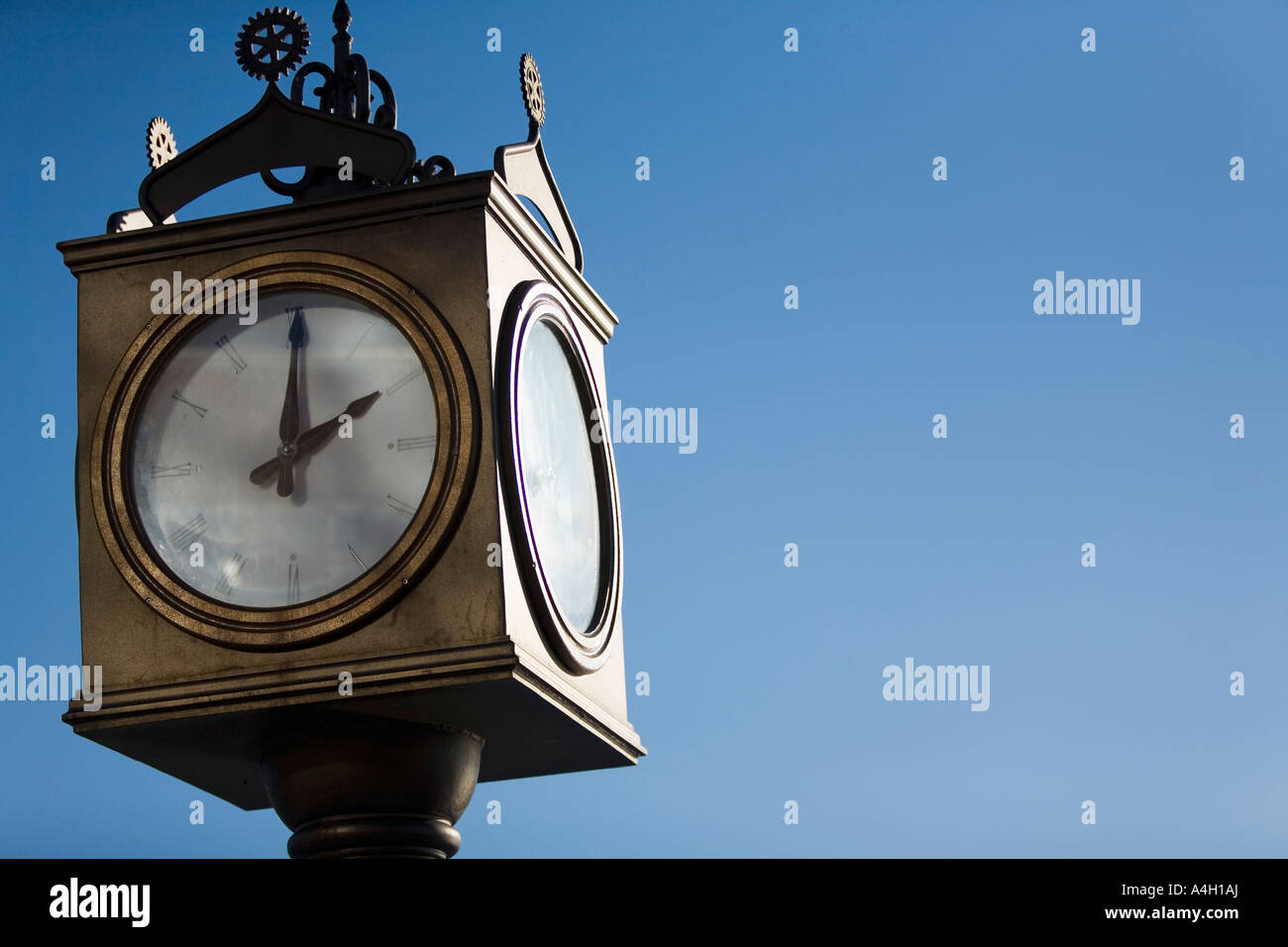 Old fashioned outdoor clock Stock Photo - Alamy
