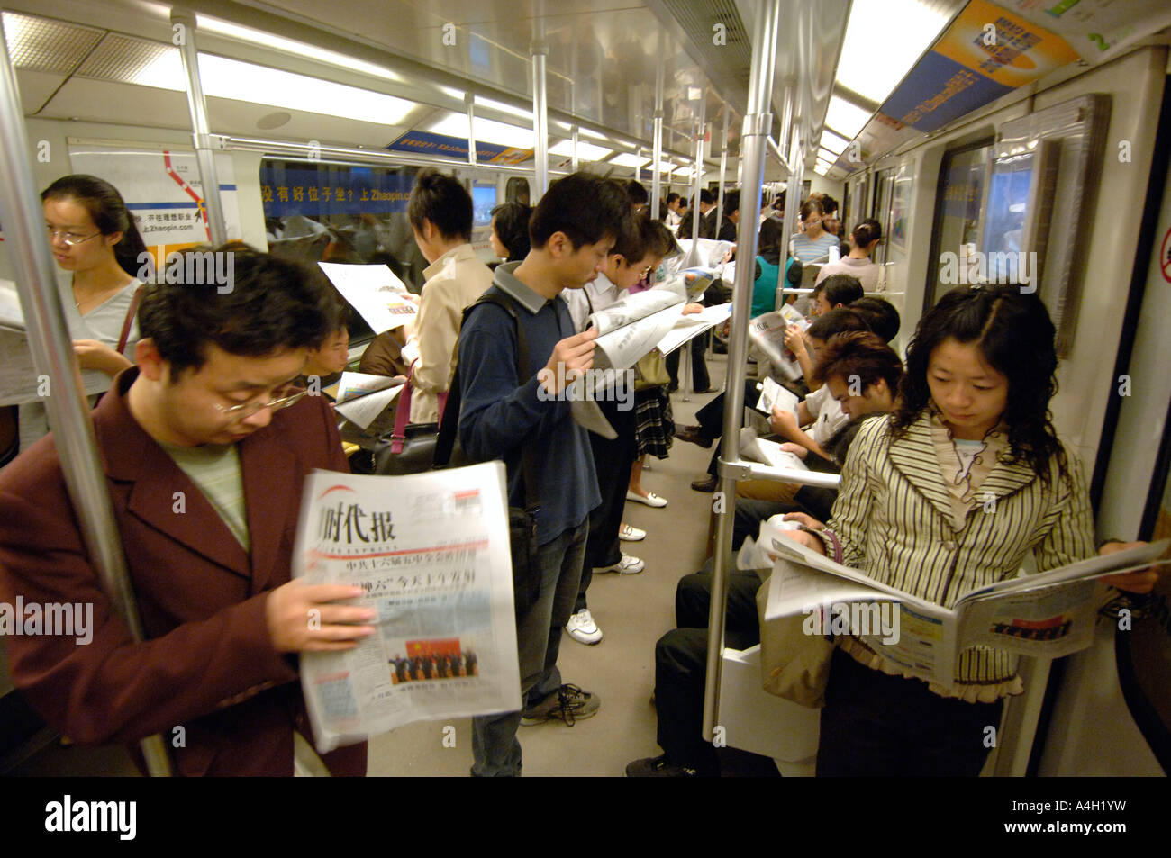 Commuters inside shanghai metro train hi-res stock photography and ...