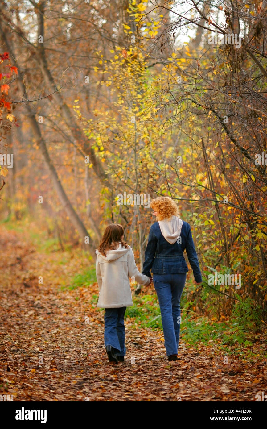 Mother and daughter walking down path Stock Photo - Alamy