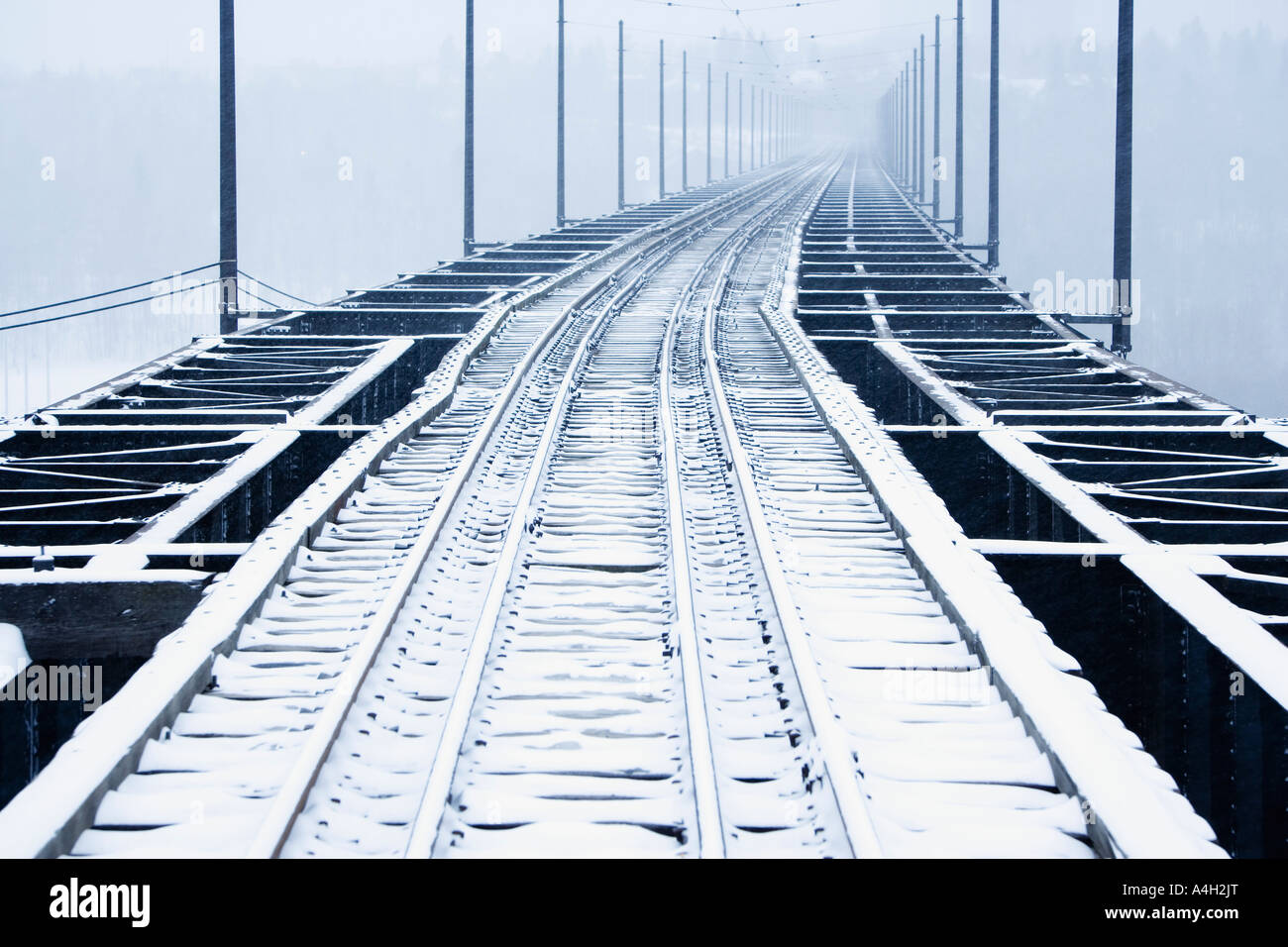 Snow covered train tracks Stock Photo - Alamy