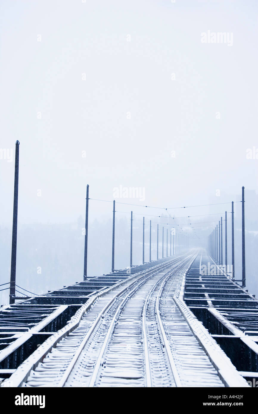 Snow covered train tracks Stock Photo - Alamy