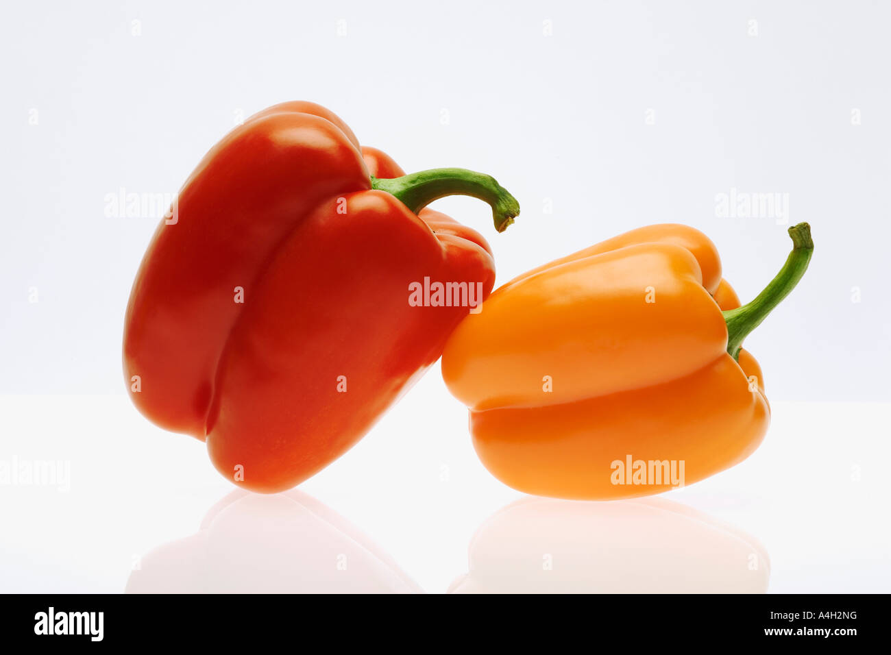 Orange and red peppers Stock Photo - Alamy
