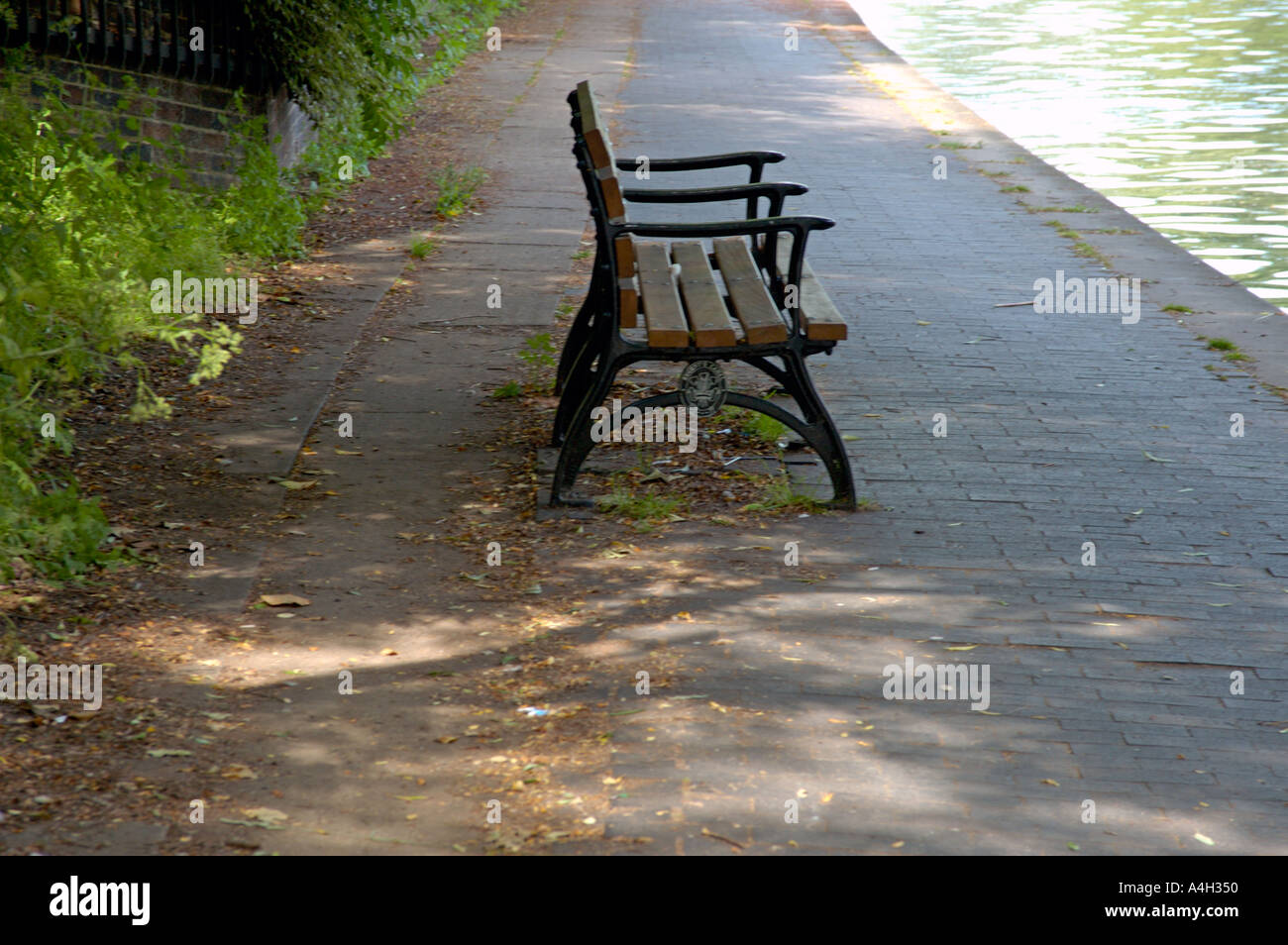 bench on towpath grand union canal London UK Stock Photo - Alamy