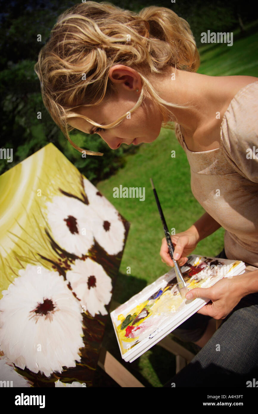 Artist painting on canvas Stock Photo - Alamy