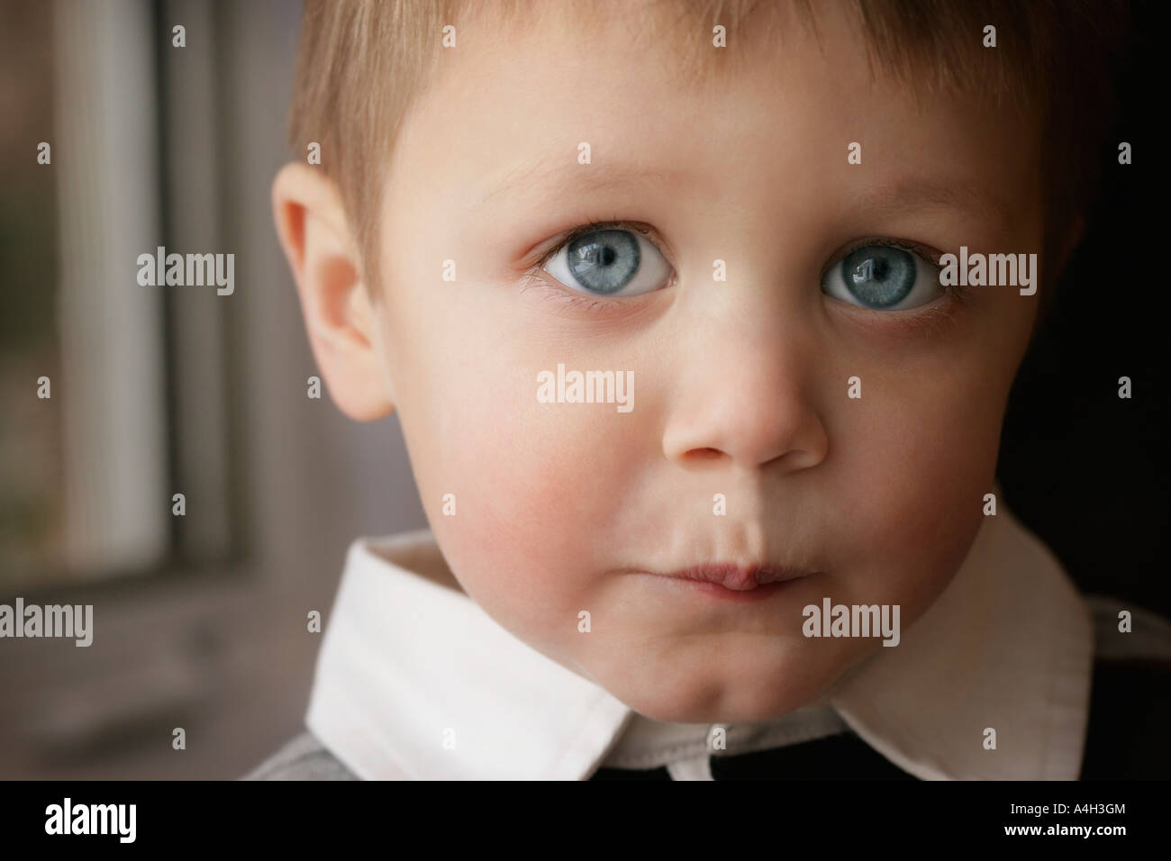 Boy keeping a secret Stock Photo - Alamy