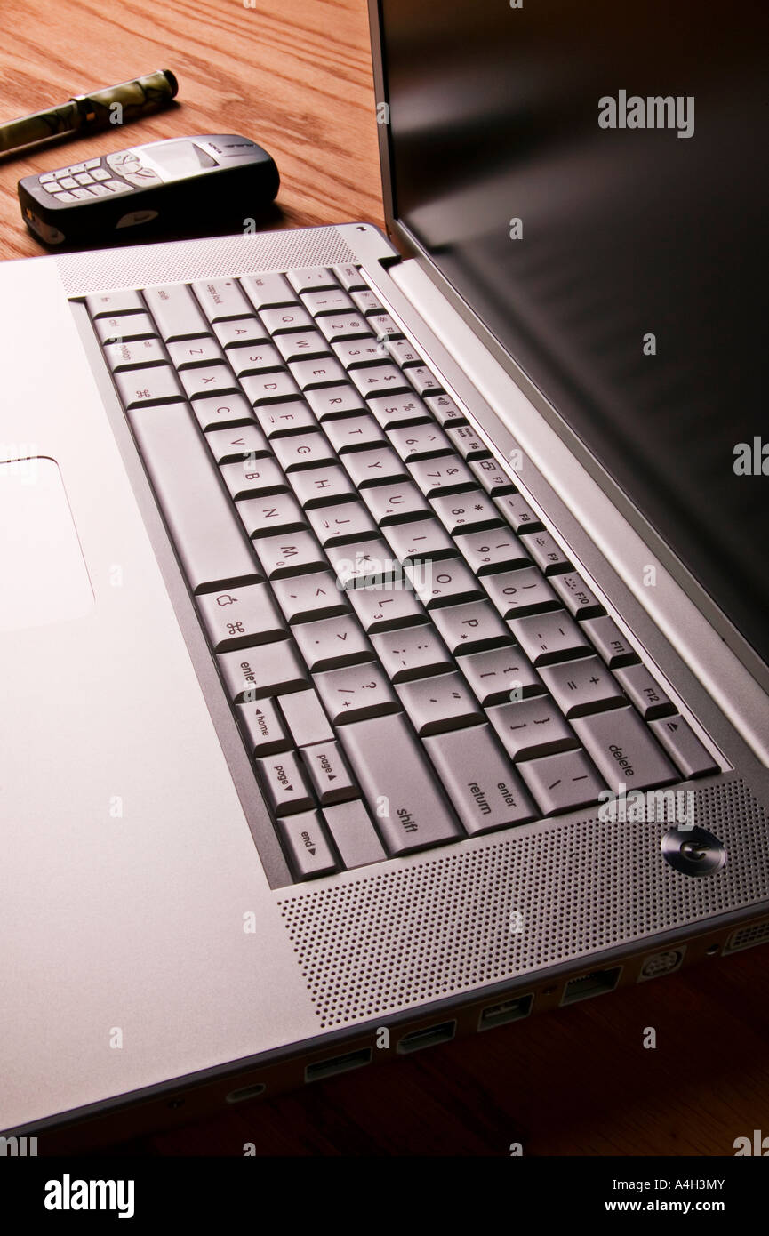 Laptop and cell phone Stock Photo - Alamy