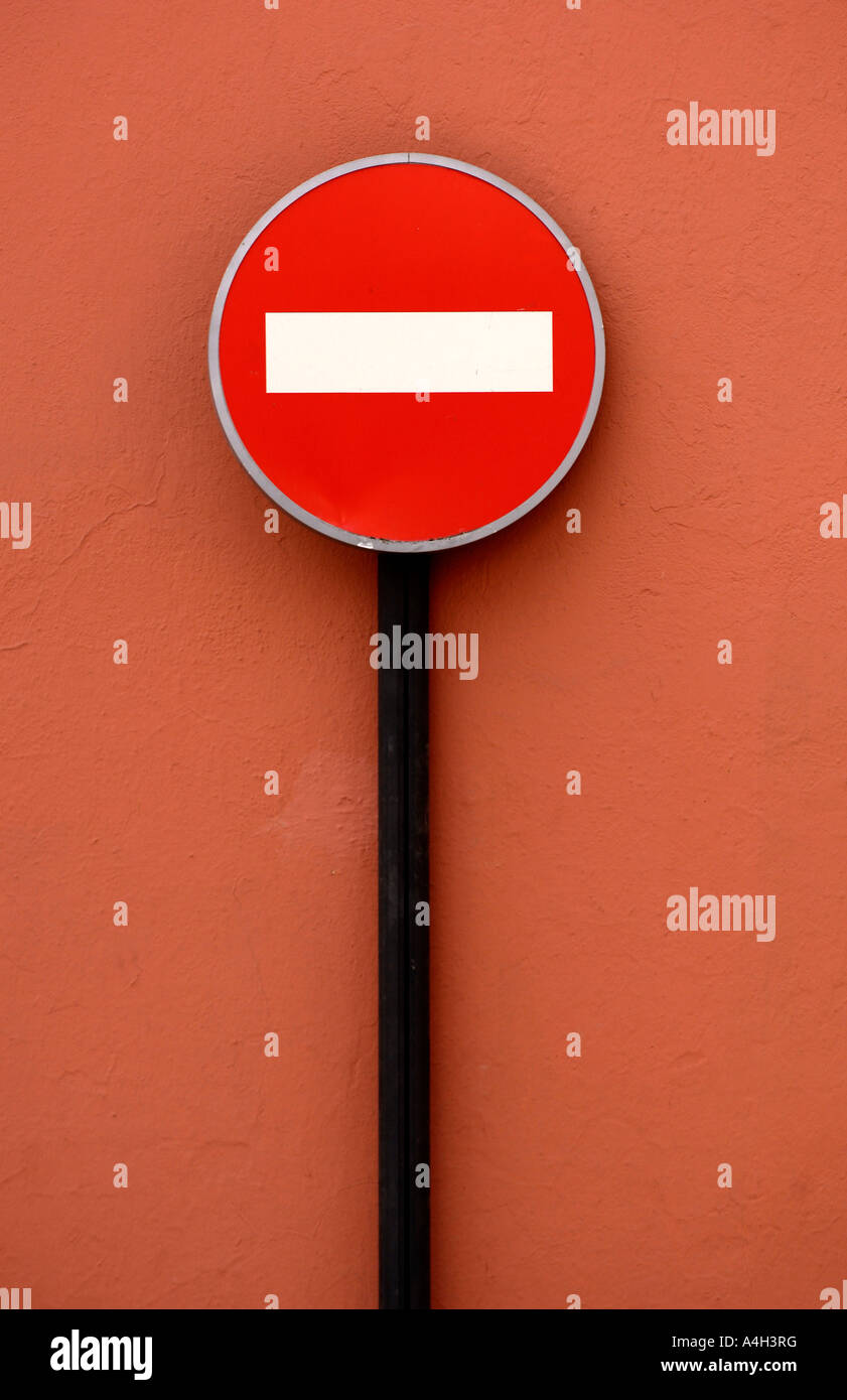 Traffic sign No Entry in front of red wall Stock Photo - Alamy