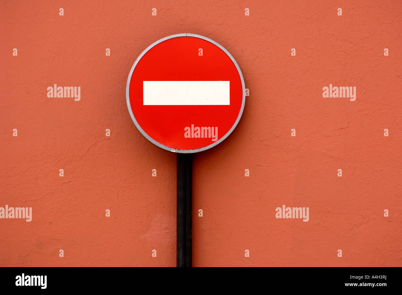 Traffic sign No Entry in front of red wall Stock Photo - Alamy
