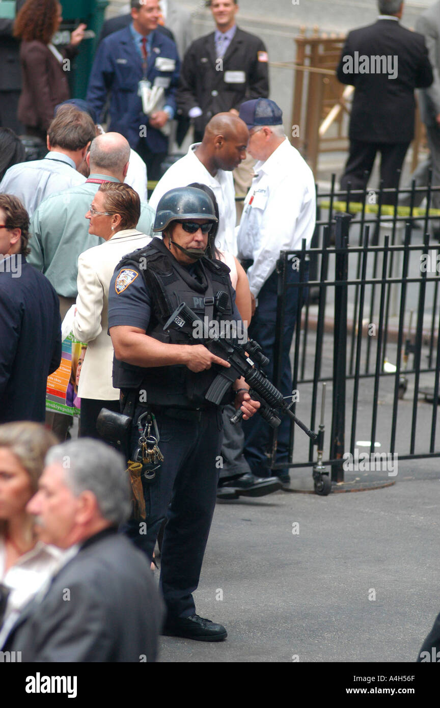 Heavily armed NYPD officers stand guard at the New York Stock Exchange ...