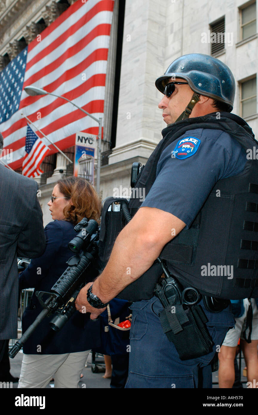 Heavily armed NYPD officers stand guard at the New York Stock Exchange ...
