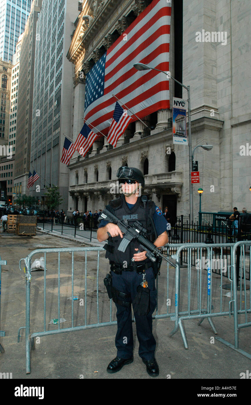 Heavily armed NYPD officers stand guard at the New York Stock Exchange ...