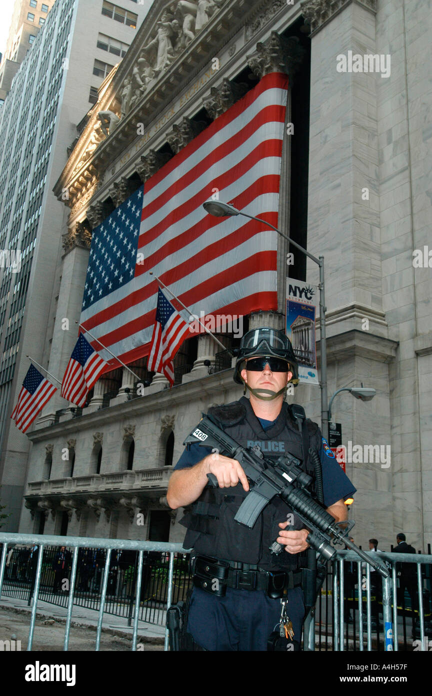 Heavily armed NYPD officers stand guard at the New York Stock Exchange ...