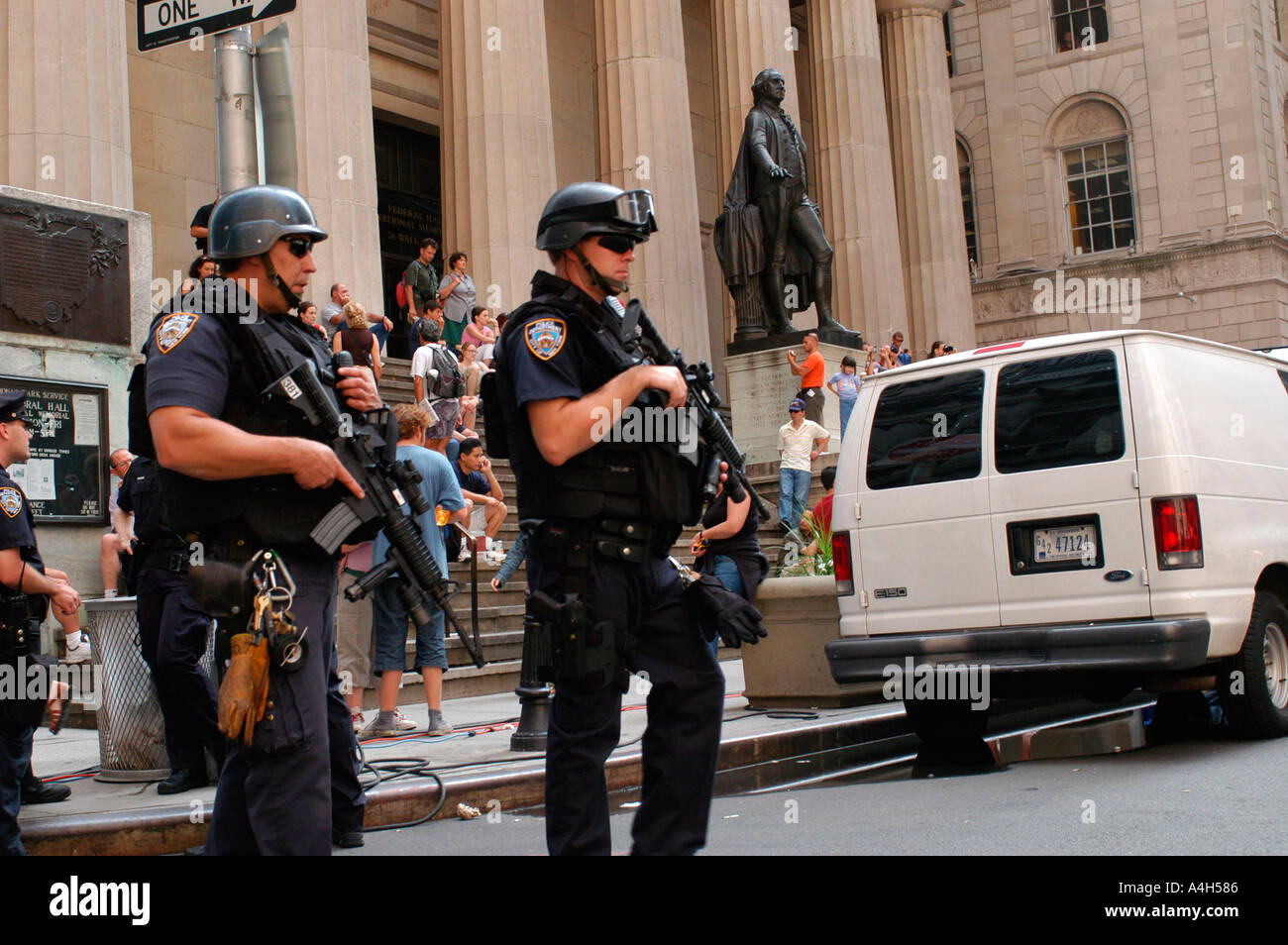 Heavily armed NYPD officers stand guard at the New York Stock Exchange ...