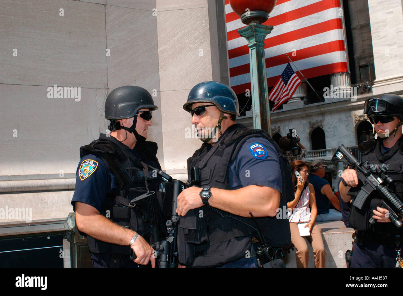 Heavily armed NYPD officers stand guard at the New York Stock Exchange ...