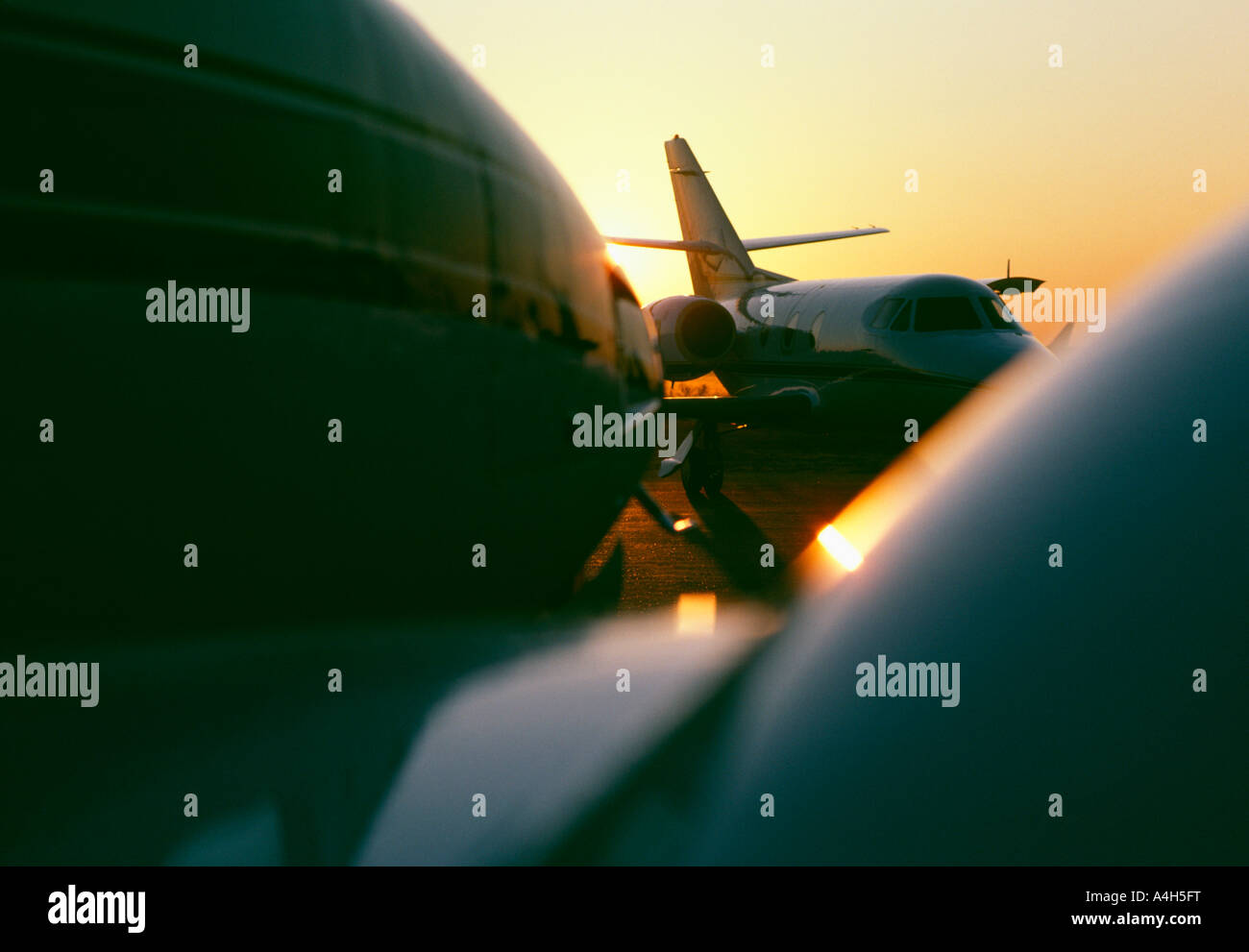 Private Jet Aircraft At Sunset Stock Photo - Alamy