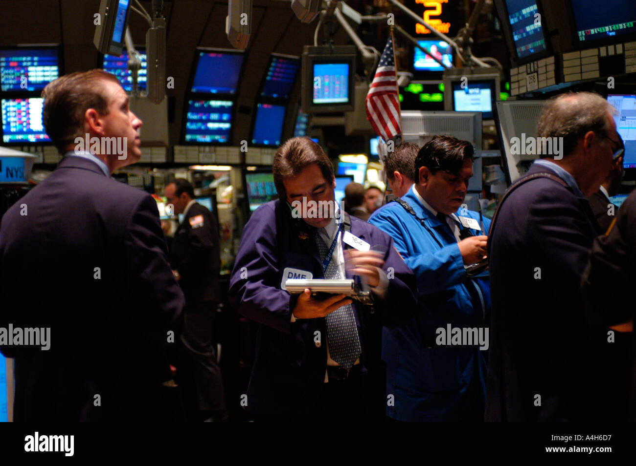Stockbrokers busy on the trading floor of the New York Stock Exchange ...