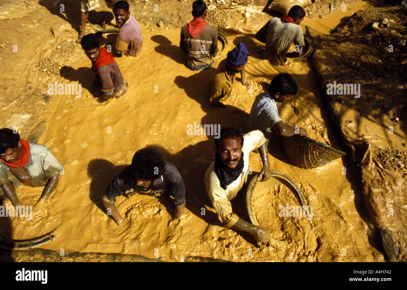 Gem miners wash stones from mud at Ratnapura Sri Lanka Stock Photo - Alamy