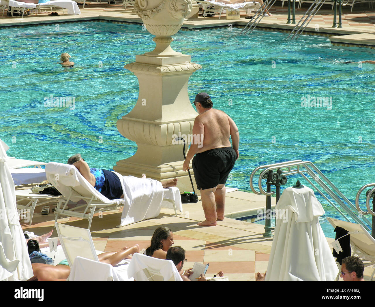 Fat man pool side hi-res stock photography and images - Alamy