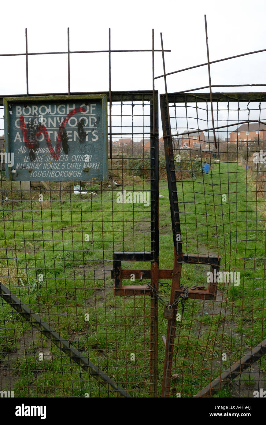 Locked allotment gates showing signs of vandalism Stock Photo - Alamy