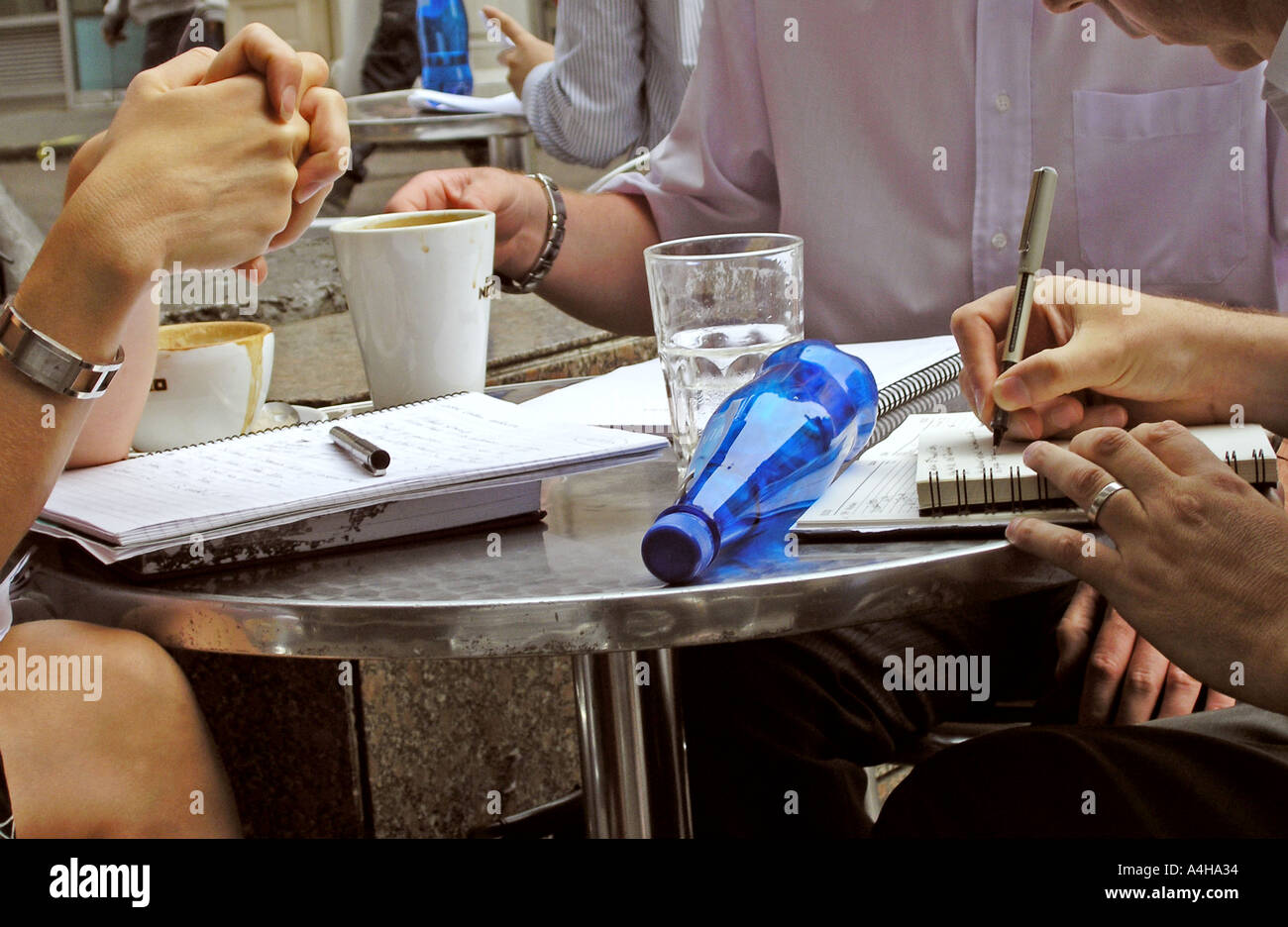Business meeting taking place in coffee bar London Stock Photo - Alamy