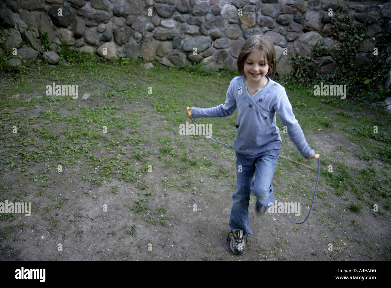 A girl jumping rope Stock Photo - Alamy