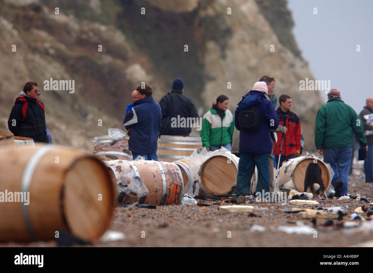 People search through the washed up goods from the MSC Napoli container ...