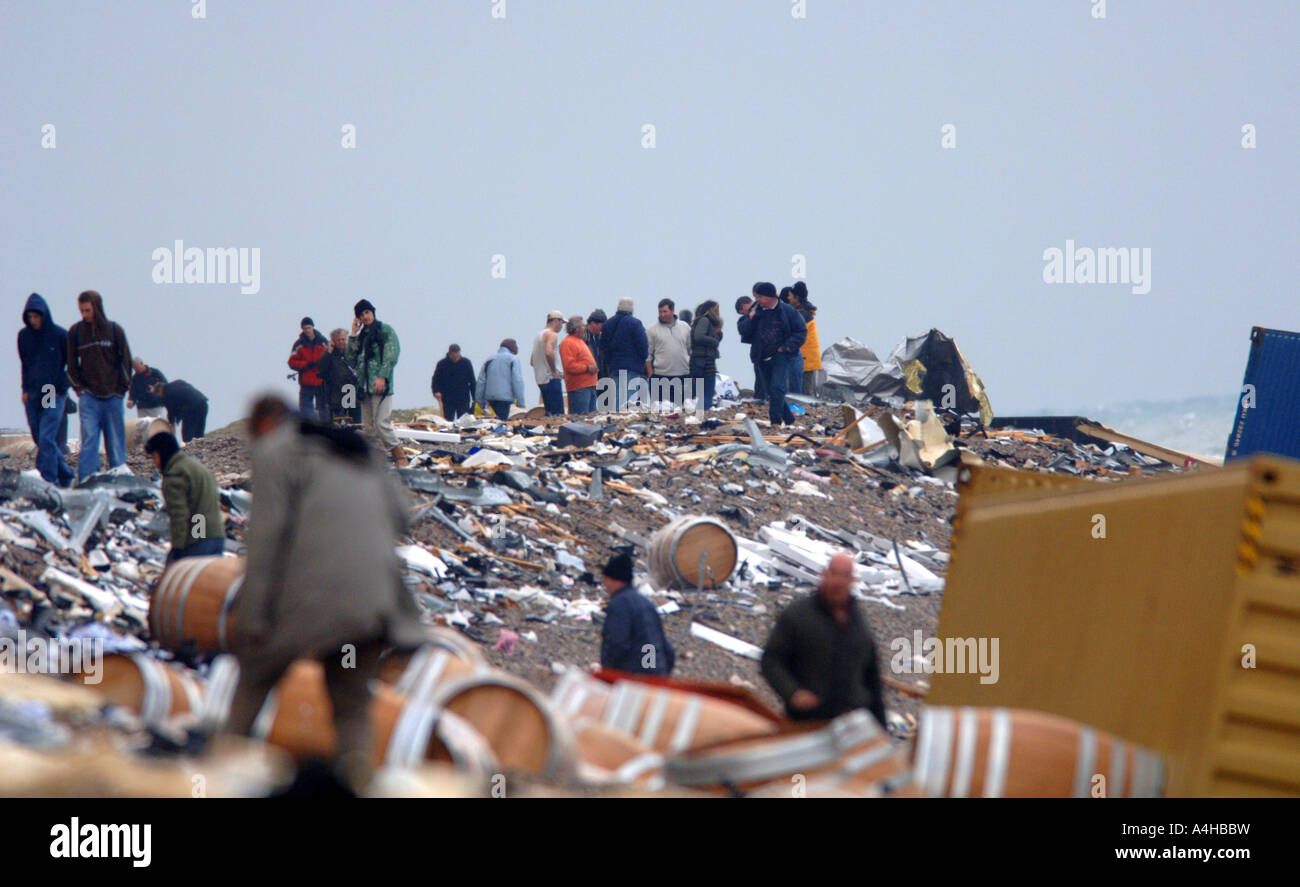 People search through the washed up goods from the MSC Napoli container ...