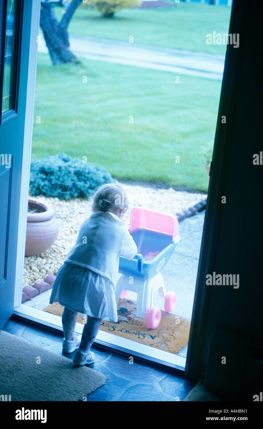 Child pushing stroller hi-res stock photography and images - Alamy