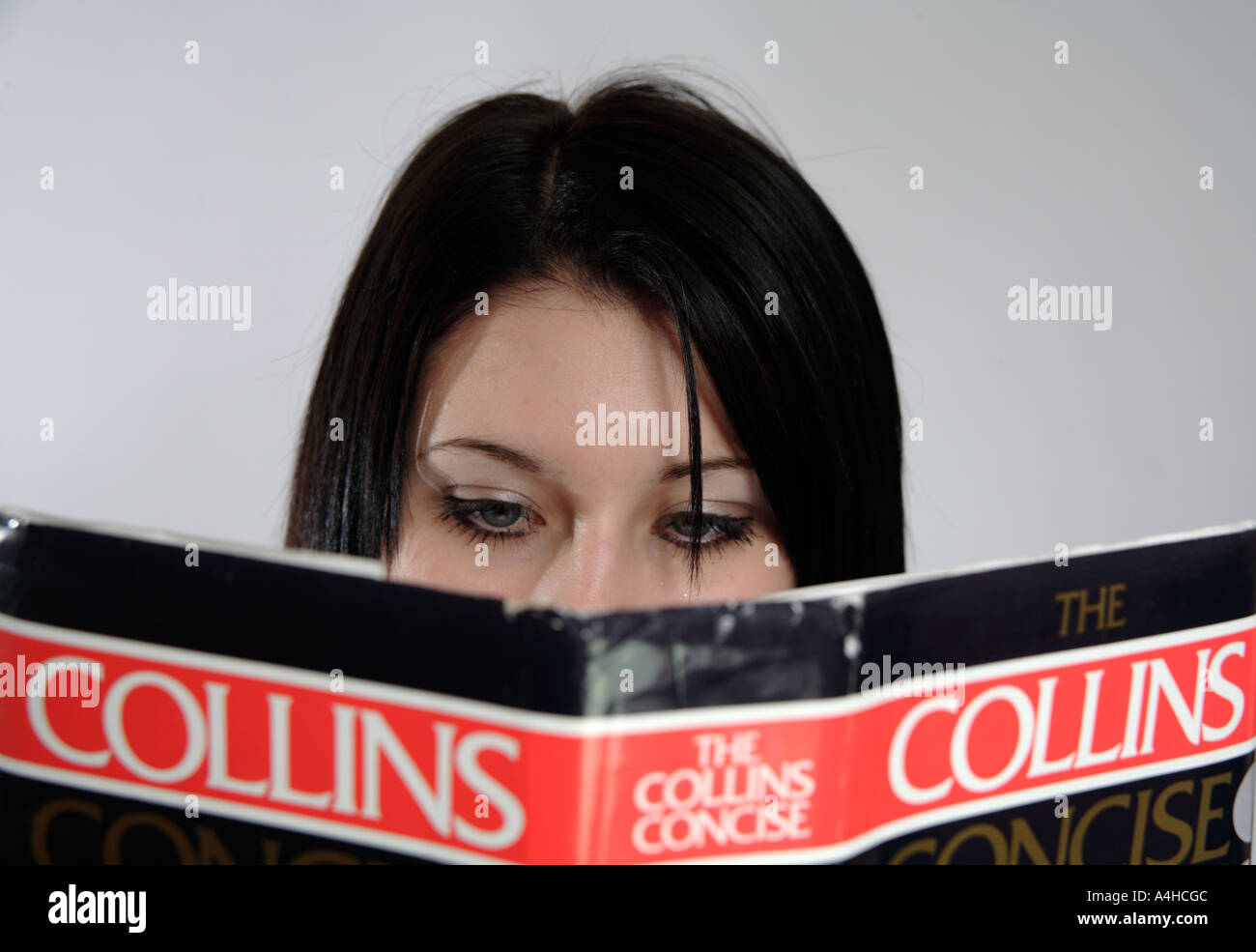 Young girl aged 16 reading a dictionary Stock Photo - Alamy