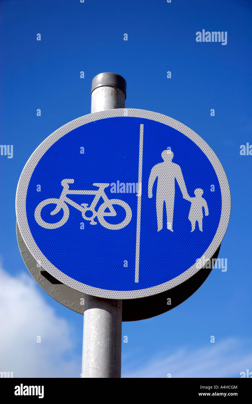 Sign showing path split for both cyclists and pedestrians Stock Photo ...