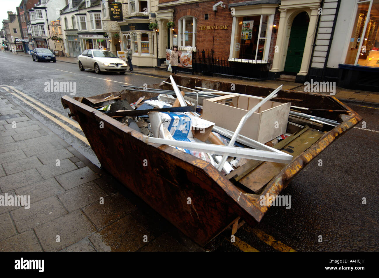Skip with rubble on the road hi-res stock photography and images - Alamy