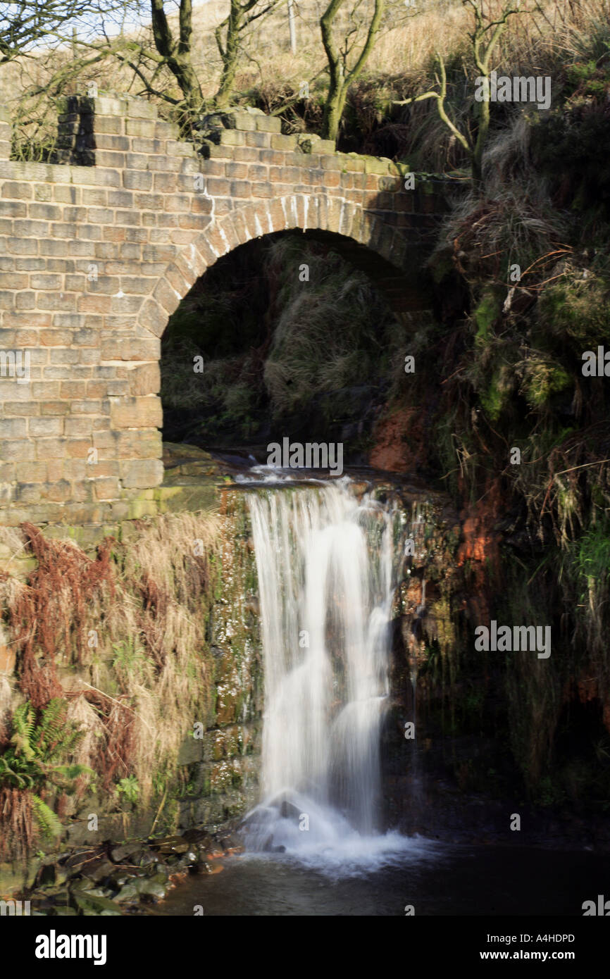 The arched remains of Cheesden Lumb Lower Mill which was water powered ...
